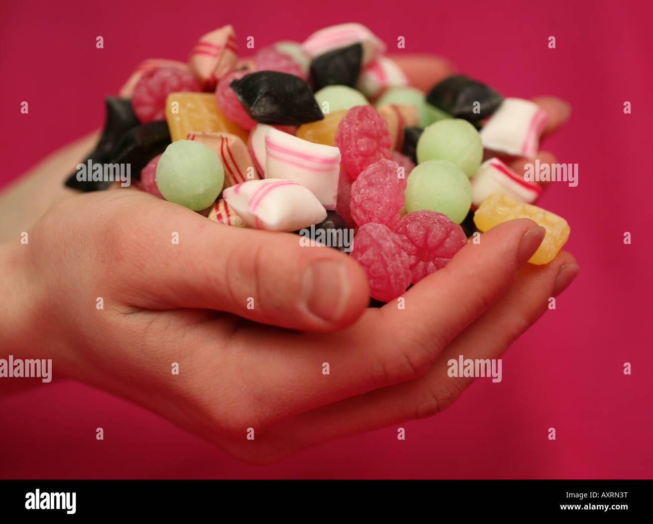 Child hand pick candy sweet hi-res stock photography and images - Alamy