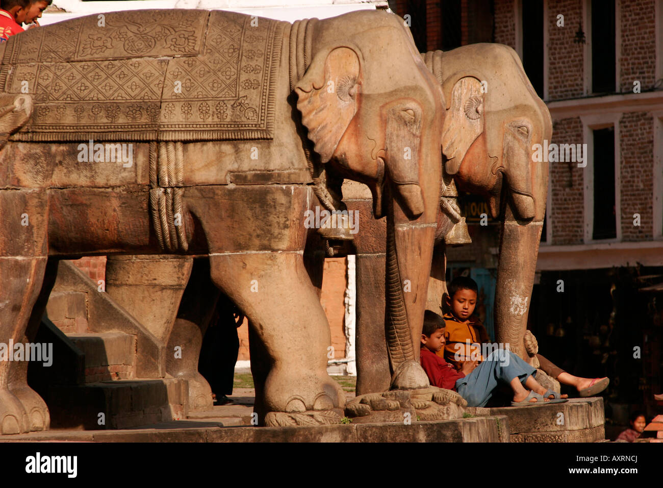 Children climbing on an elephant statue hi-res stock photography and ...