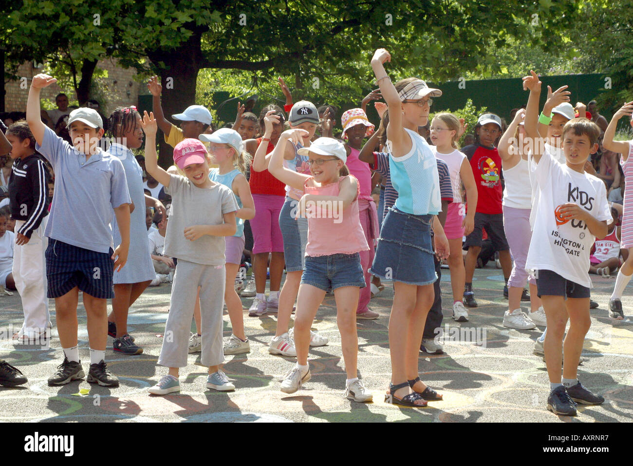 primary school children in the playground dancing Stock Photo - Alamy
