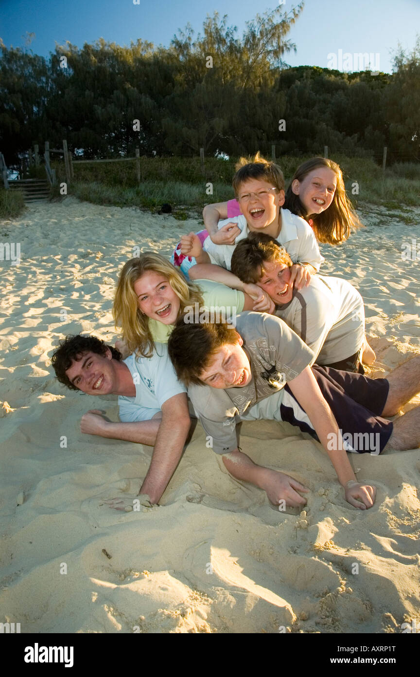 kids play stacks on the mill on beach Stock Photo - Alamy