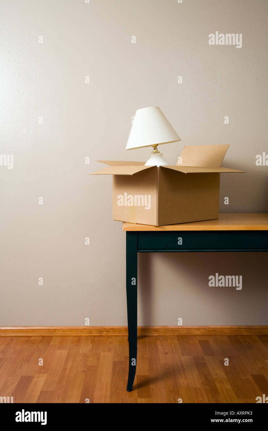 Moving box on a table Stock Photo - Alamy