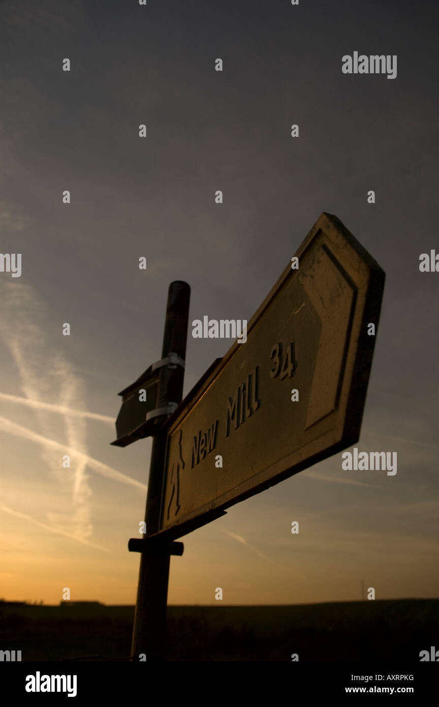 sign post to New Mill at sunset Stock Photo - Alamy