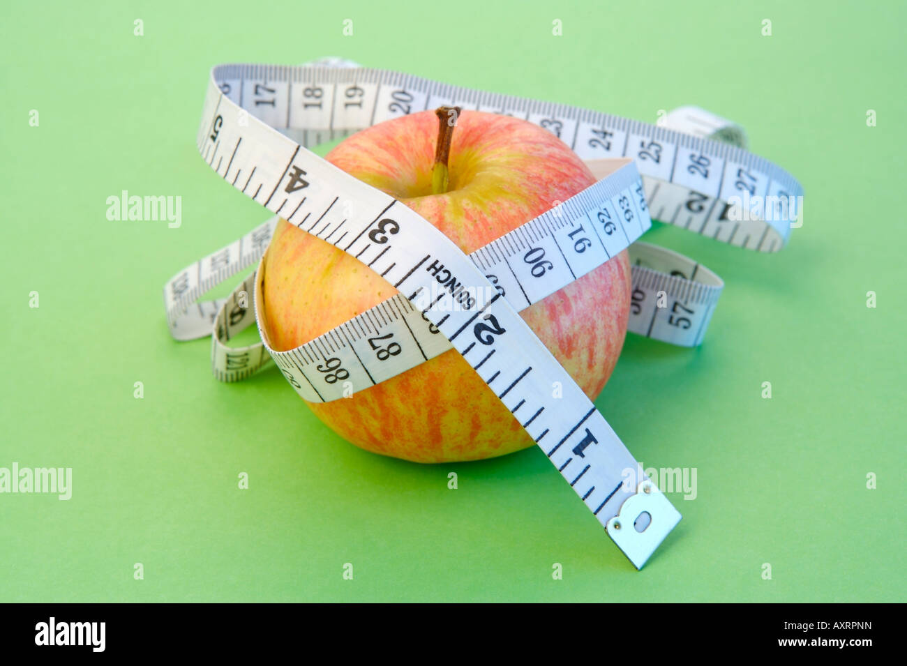Apple and Measuring Tape Stock Photo - Alamy
