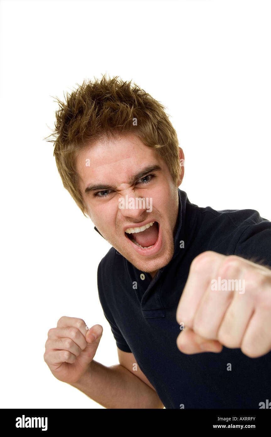 angry young man throwing a punch Stock Photo - Alamy