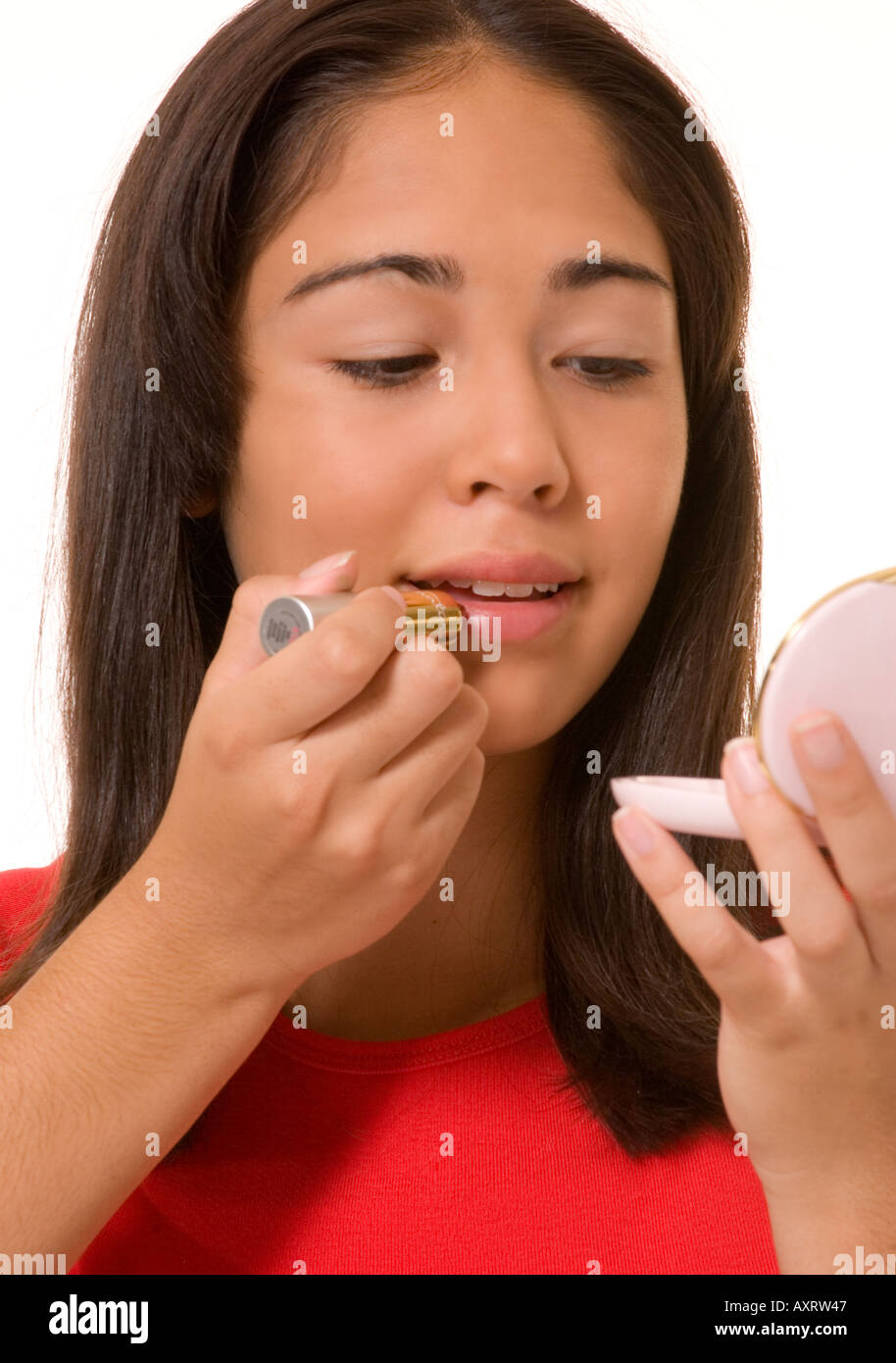 Teen girl applying lipstick hi-res stock photography and images - Alamy