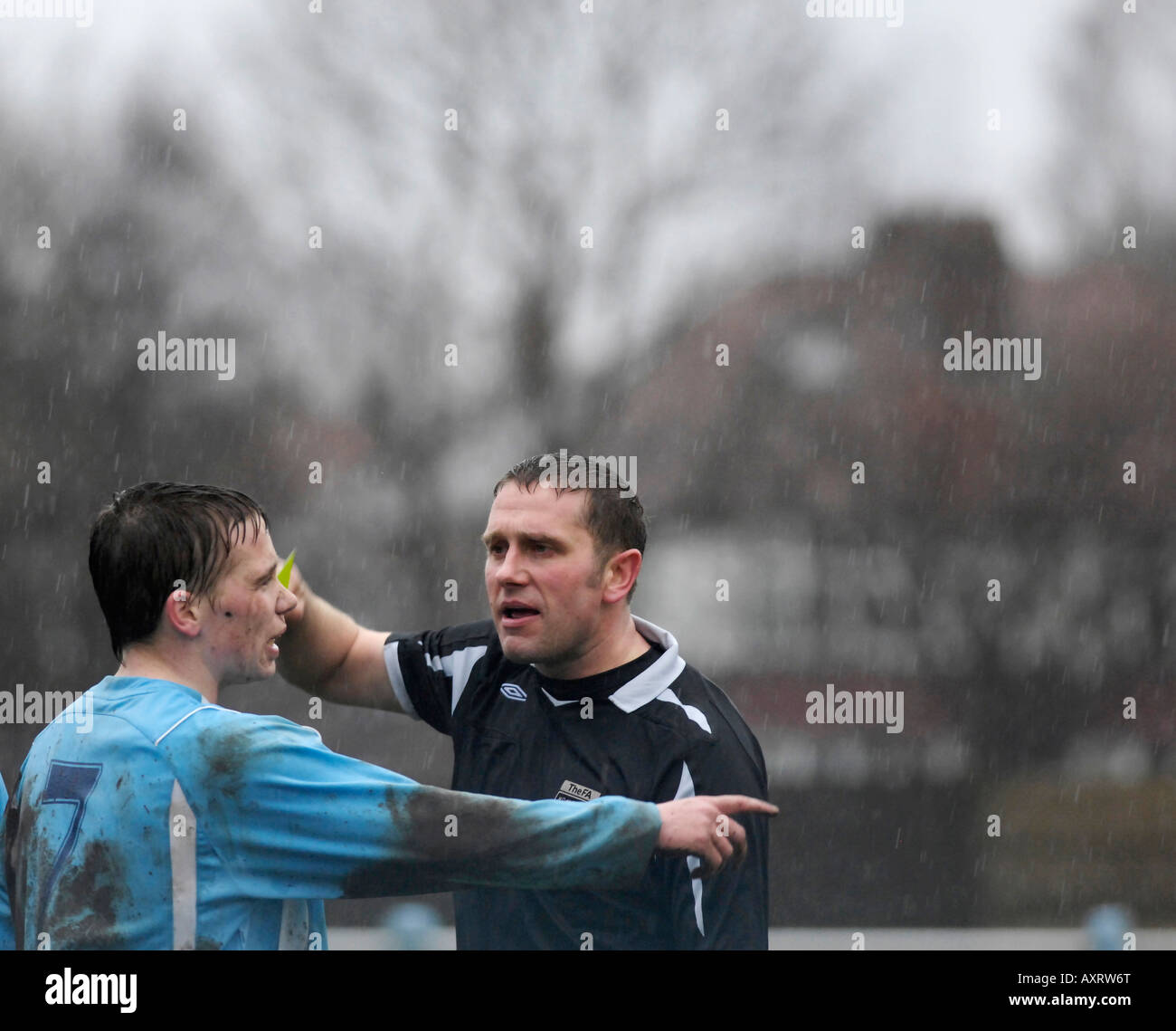 footballer disputing referee's decision to give him a yellow card Stock ...