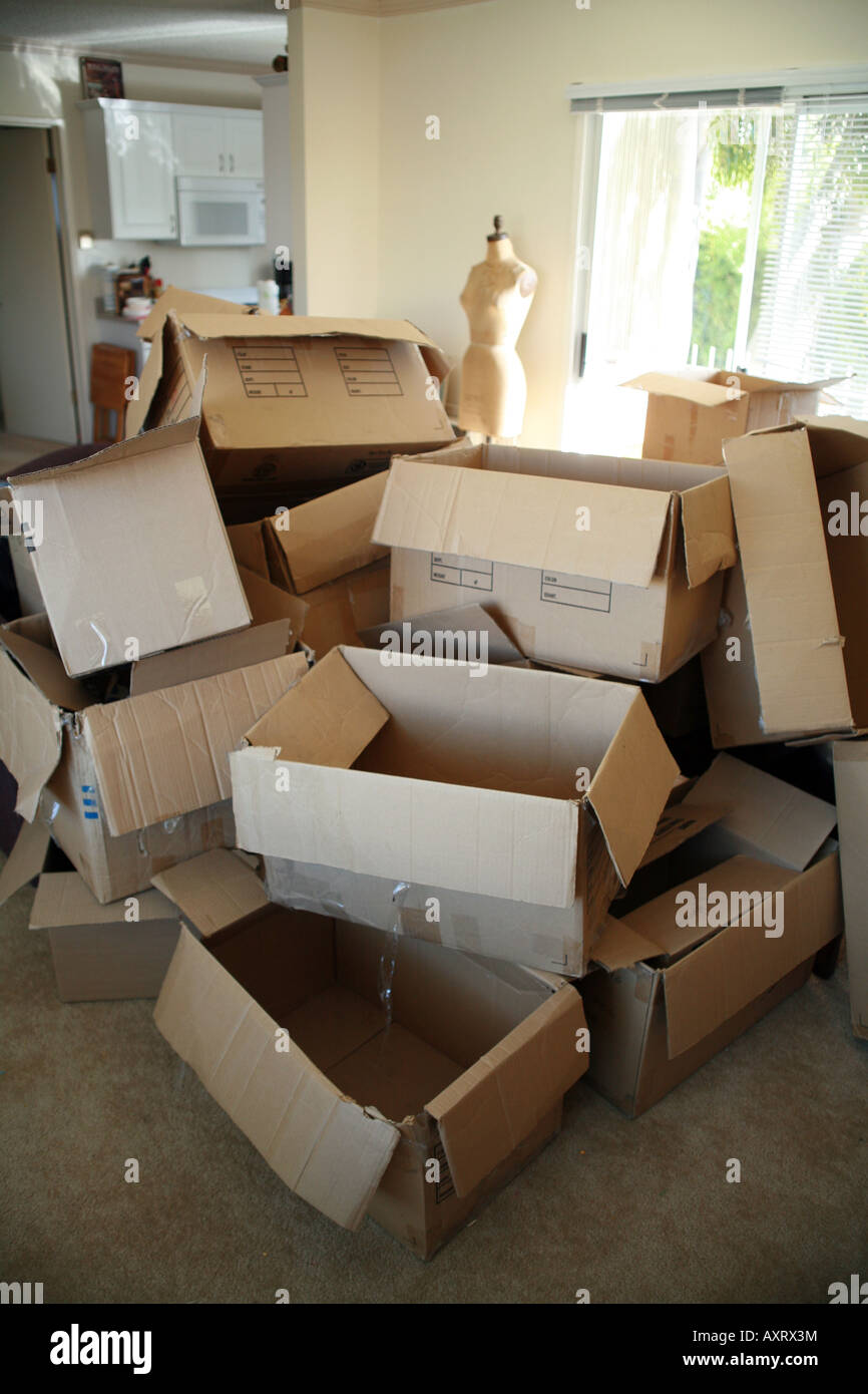 A Big Stack of Empty Moving Boxes Unpacked in a New Home Stock Photo ...