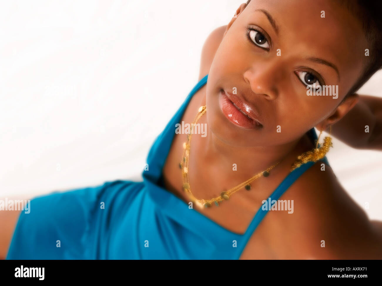 Close-up portrait of a pretty young Jamaican woman, aged 18 to 20, in ...