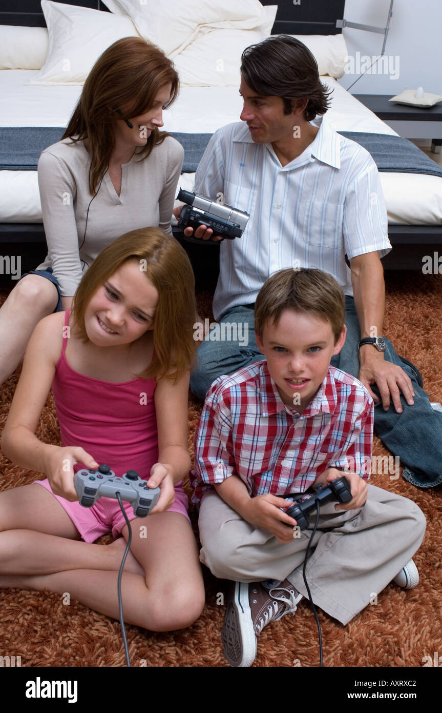Portrait of a family enjoying technology Stock Photo - Alamy
