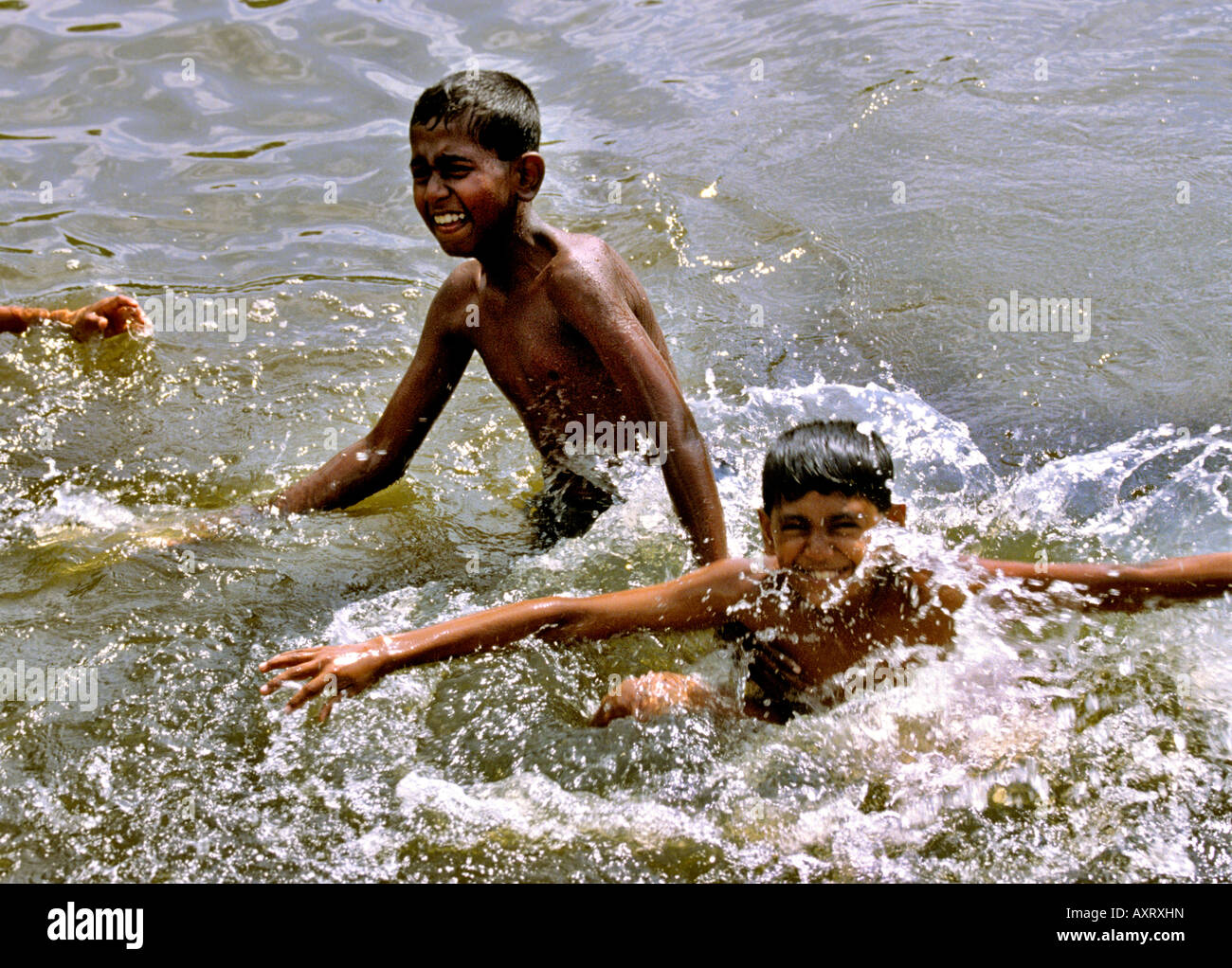 Sri Lanka Unawatuna children playing in stream Stock Photo - Alamy