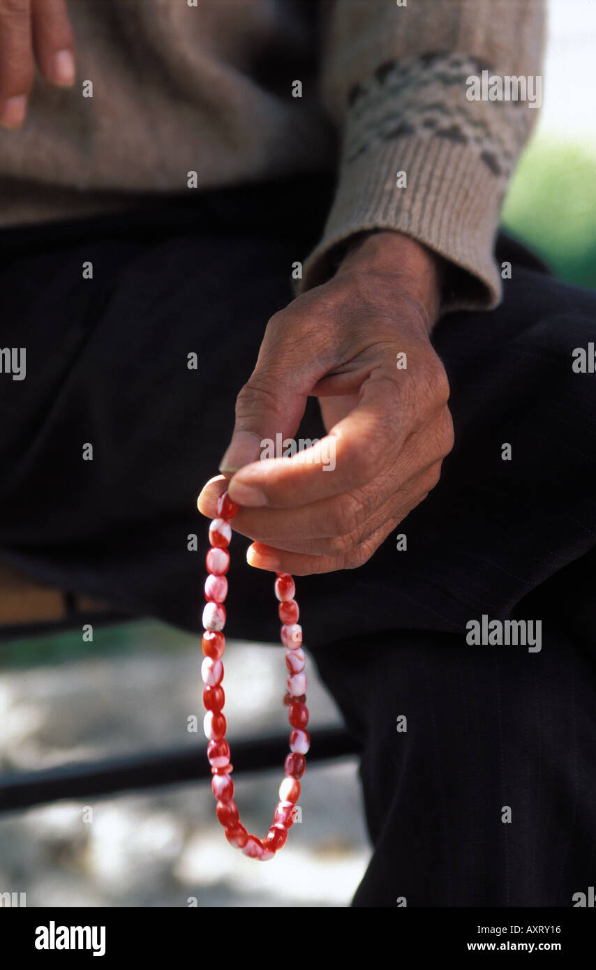 hand with prayer beads Stock Photo - Alamy