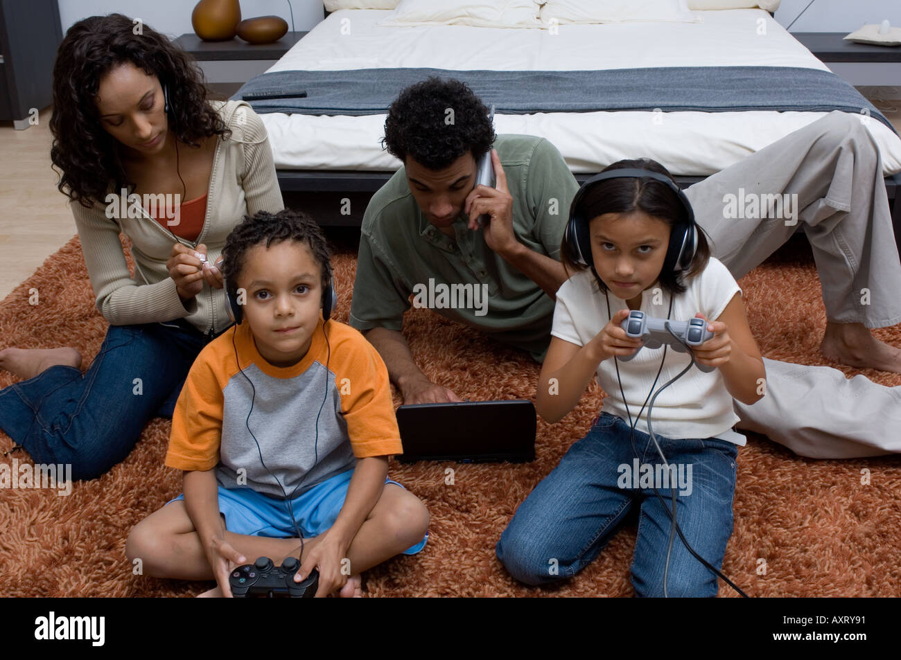 Portrait of a family enjoying technology Stock Photo - Alamy