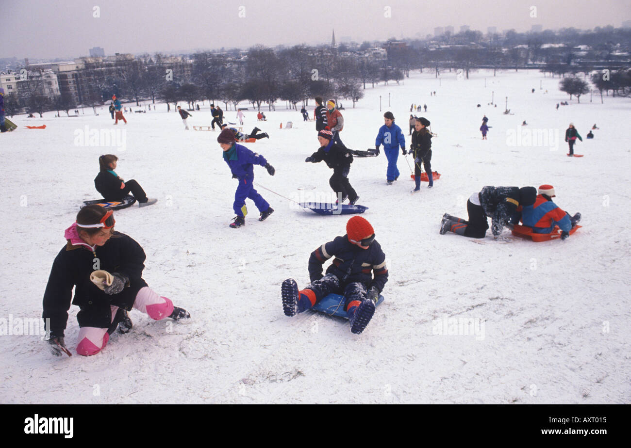 Snow UK 1990s Primrose Hill. Teenagers tobogganing winter in London ...