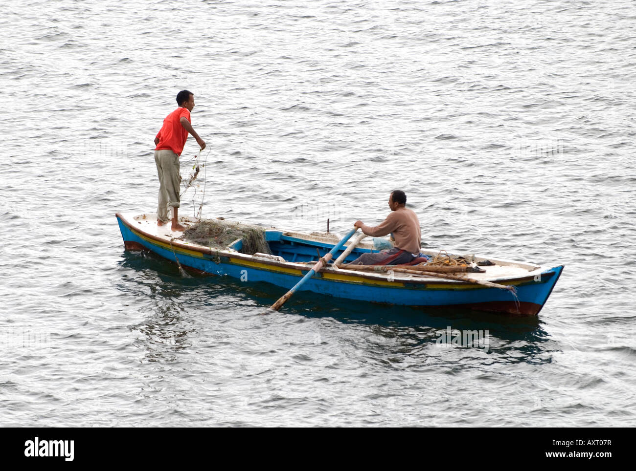 Fishermen in their boat in the Suez Canal Ismailia Egypt Stock Photo ...