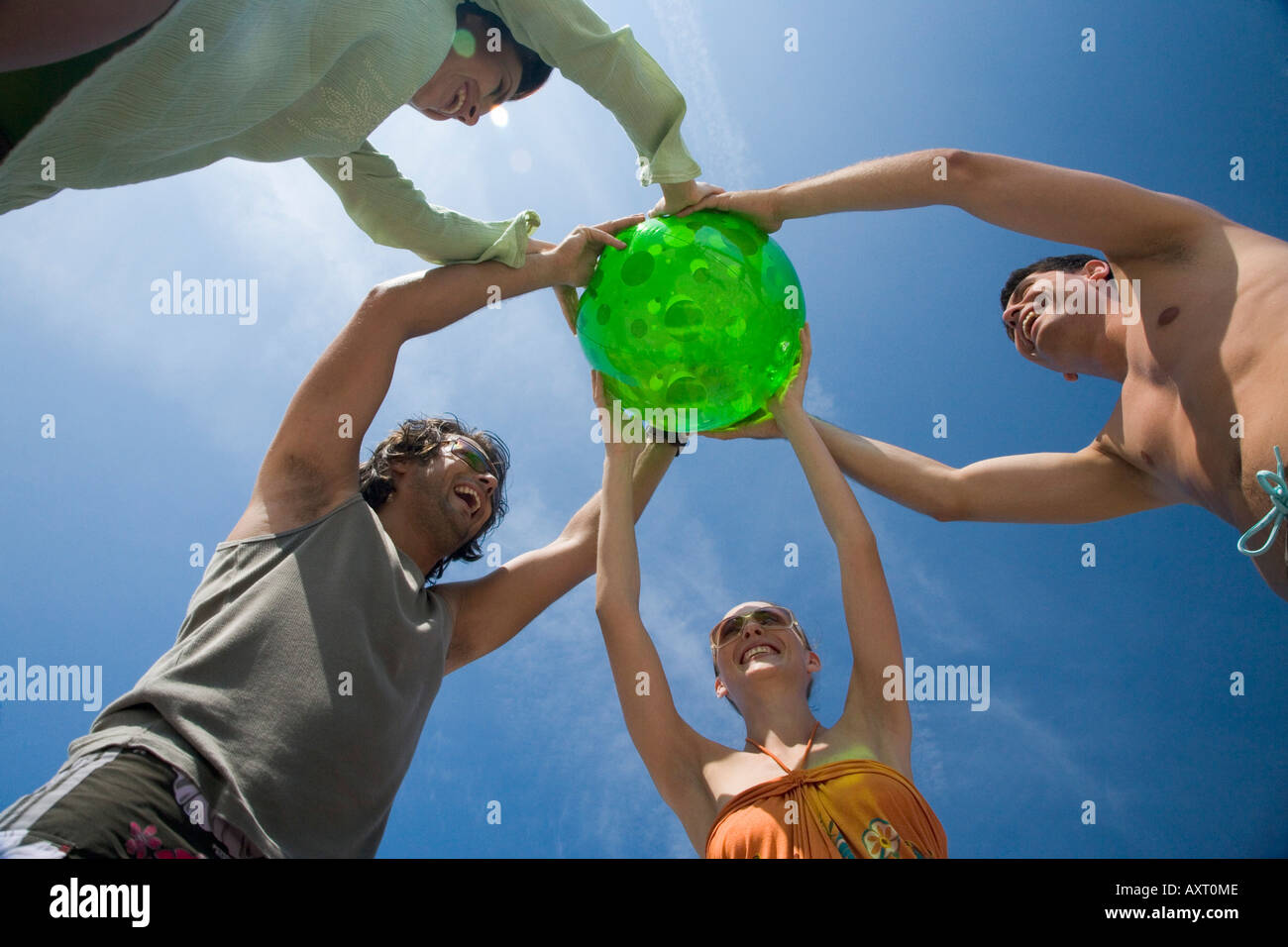 friends playing with ball Stock Photo - Alamy
