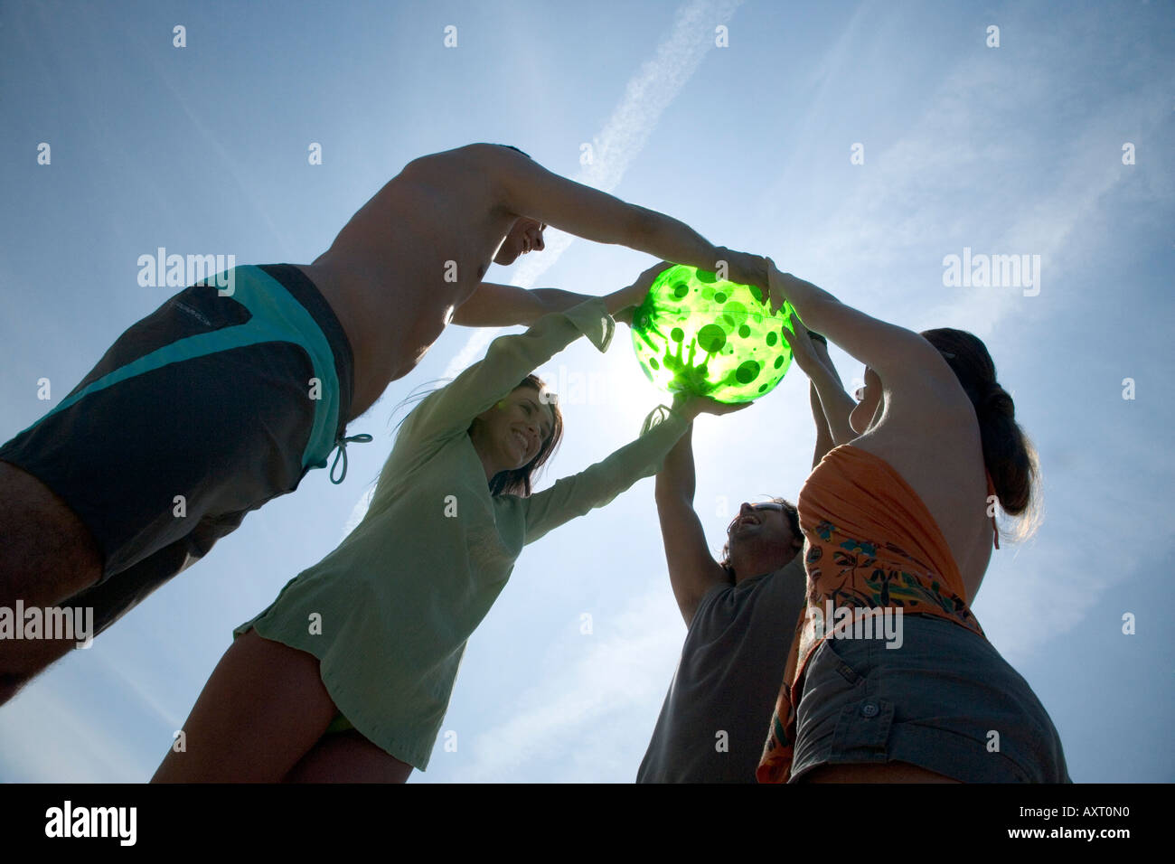 friends playing with ball Stock Photo - Alamy