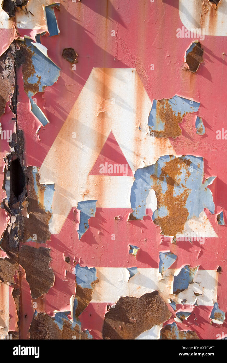 Peeling letter A on rusting disused scrap yard gates. Use for drop caps ...