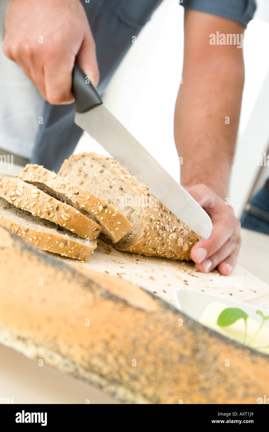 cutting bread into slices Stock Photo - Alamy