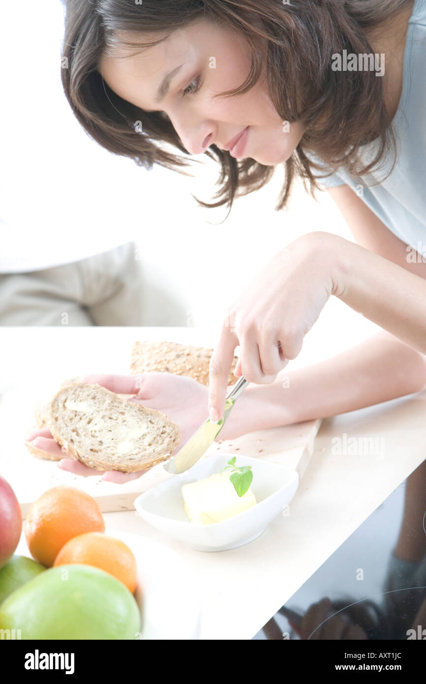 woman buttering bread Stock Photo - Alamy
