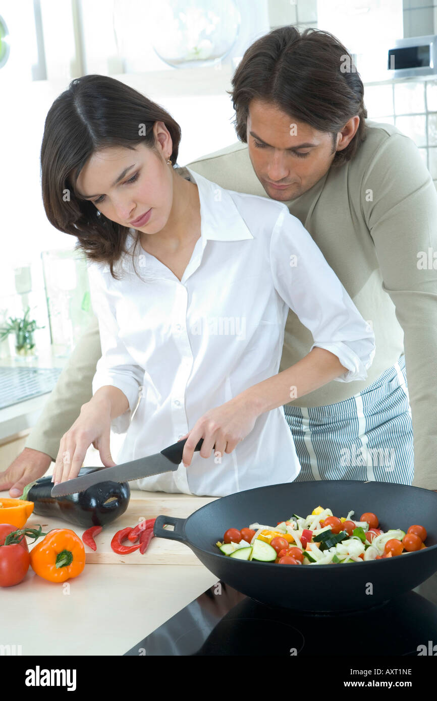 Boy and girl in kitchen making dinner hi-res stock photography and ...
