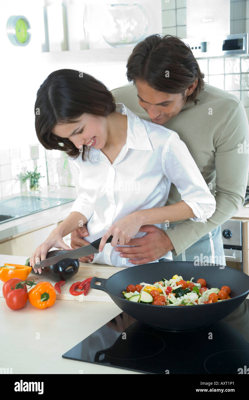 Boy and girl in kitchen making dinner hi-res stock photography and ...