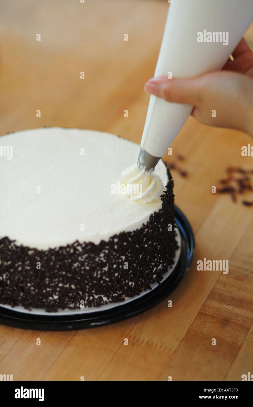 Pastry chef making a Black Forest Cake Stock Photo - Alamy