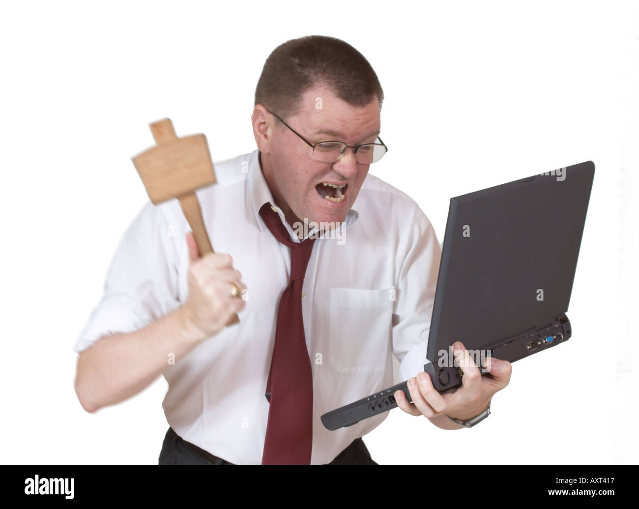 Computer Failure - A business man shows his anger with his laptop ...