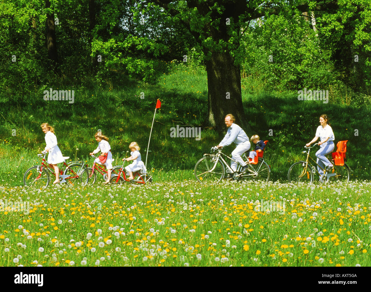 Family fun mother father children bikes hi-res stock photography and ...
