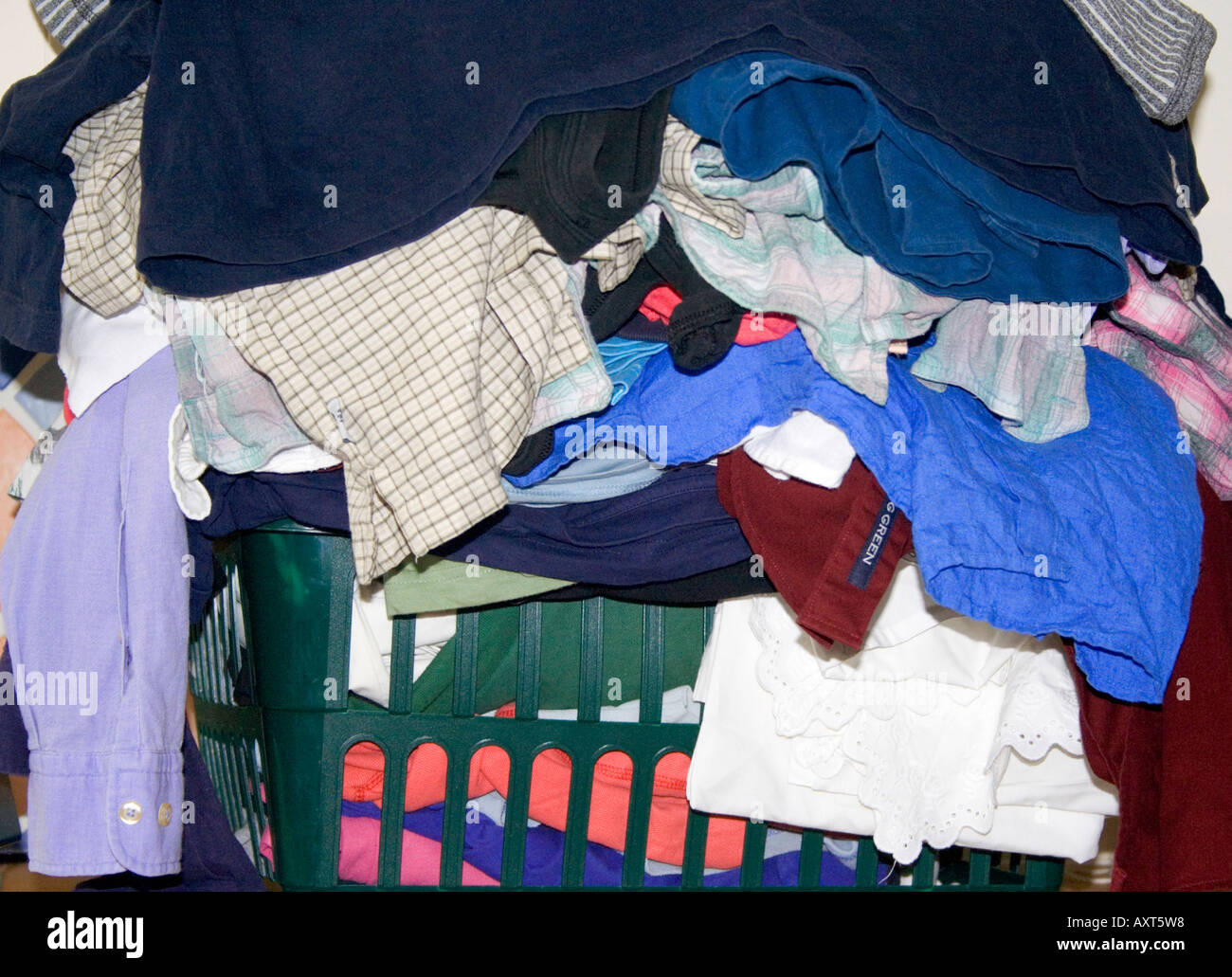 Overflowing laundry basket hi-res stock photography and images - Alamy