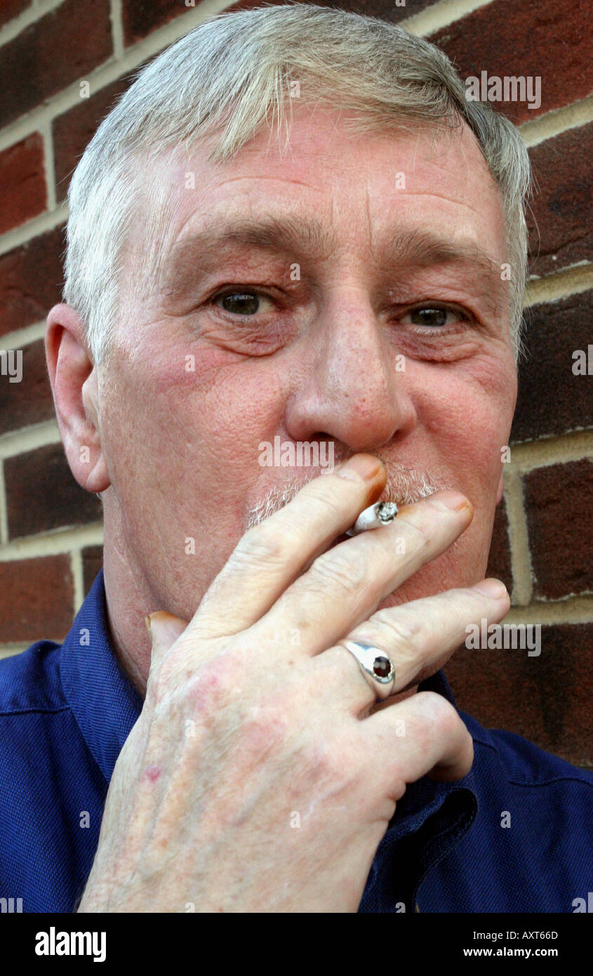 middle aged man smoking Stock Photo - Alamy