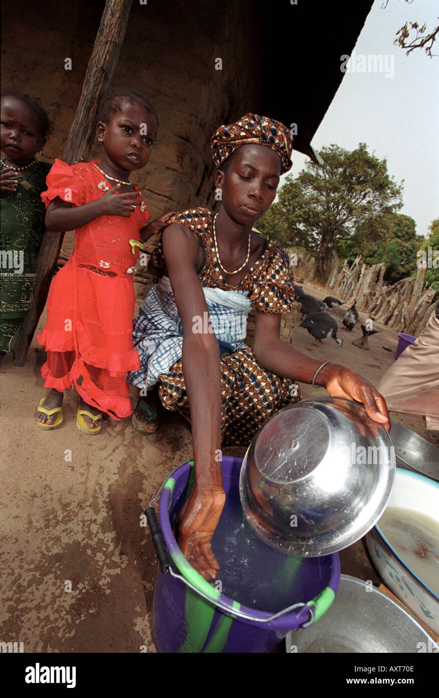 An African woman washing up dishes in The Gambia West Africa Stock ...