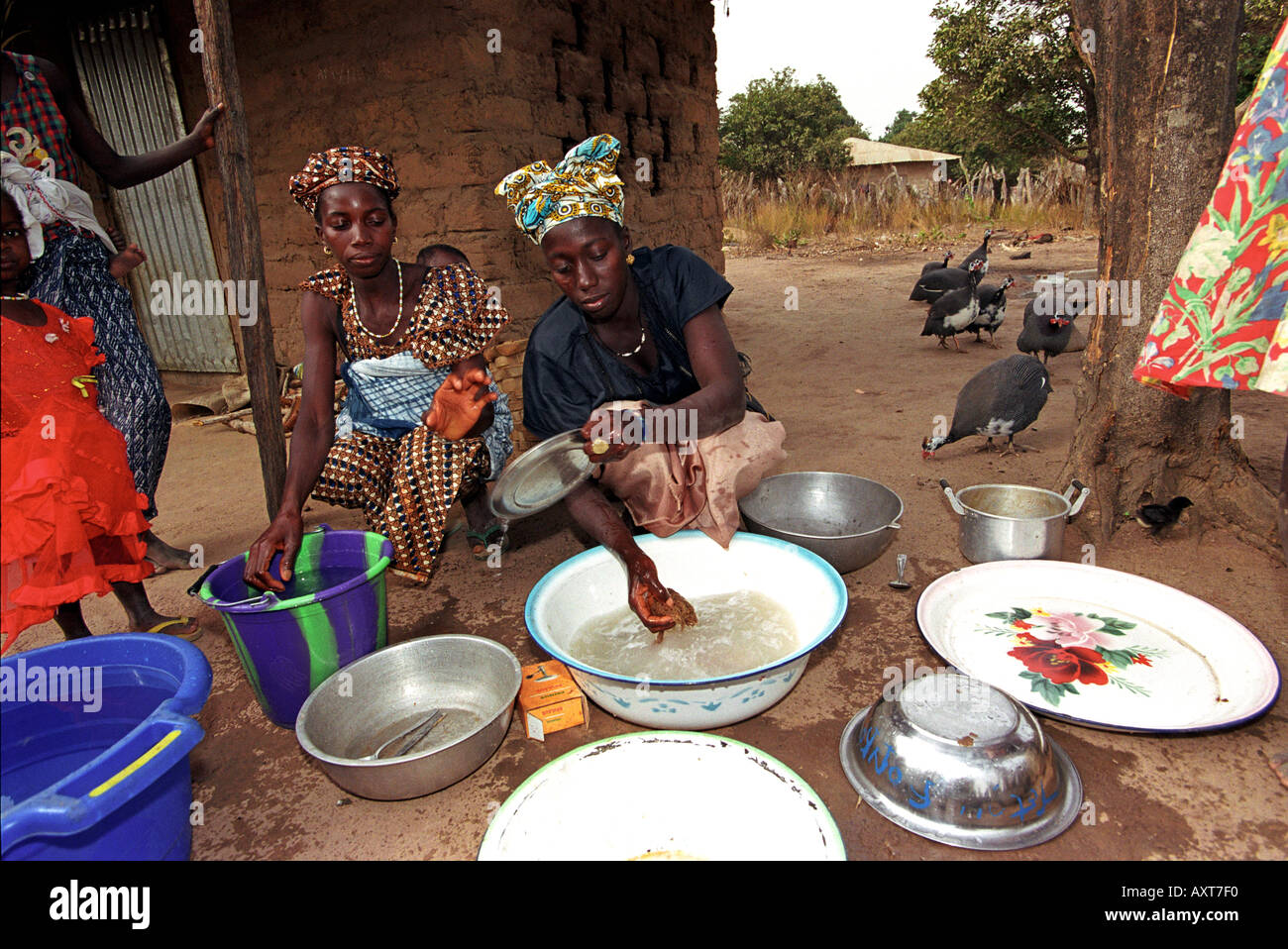 An African woman washing up dishes in The Gambia West Africa Stock ...