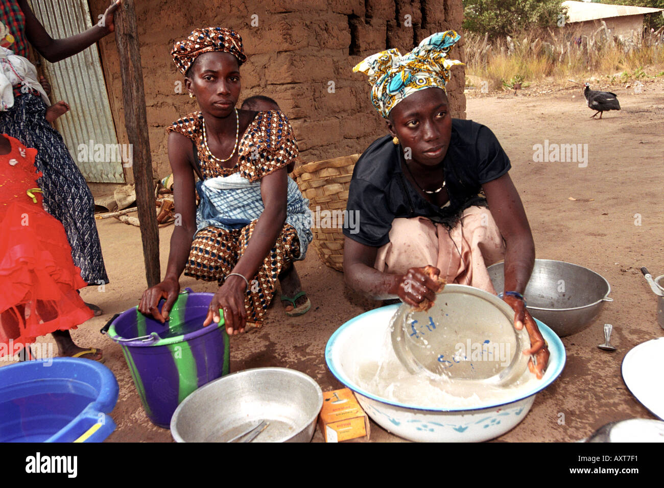 An African woman washing up dishes in The Gambia West Africa Stock ...