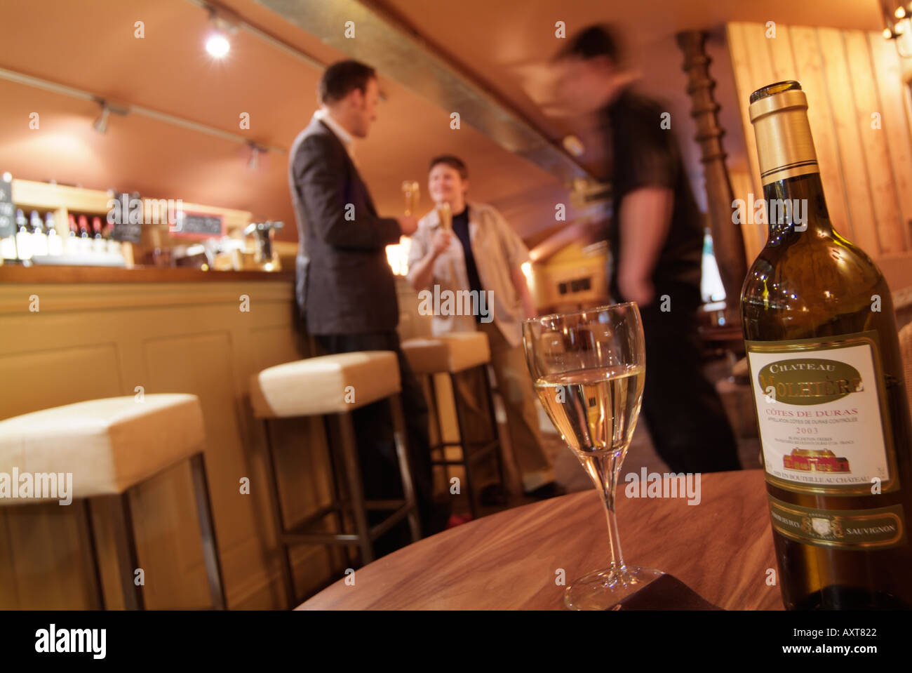 People enjoying a drink in a bar Stock Photo - Alamy