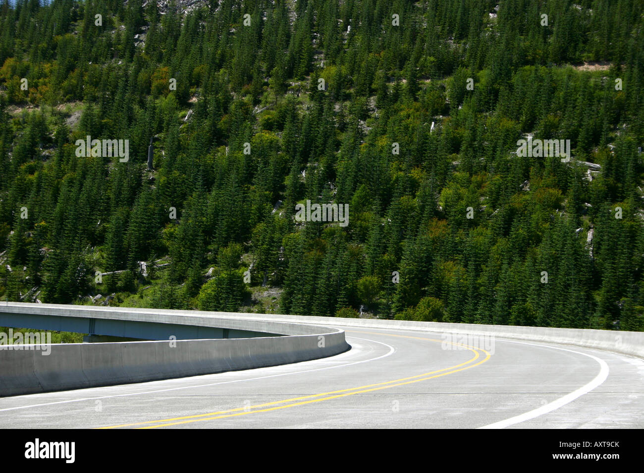 Curved stretch of new concrete highway on a bridge in Washington State ...