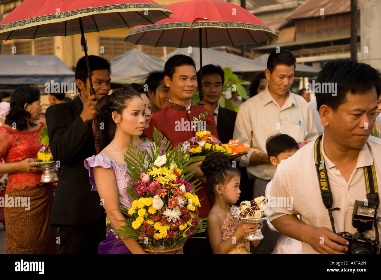 A photographer takes photos of a Cambodian wedding party Stock Photo ...