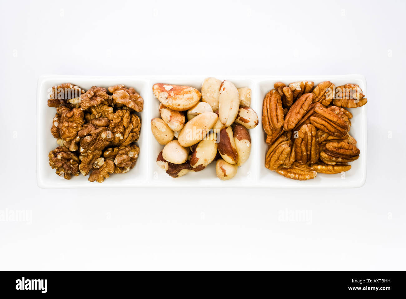 Three types of nut kernel Shelled Walnuts Brazil nuts and Pecans Stock ...