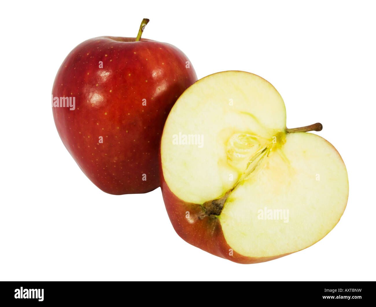 Tasty red apple cut in half isolated on white background Stock Photo ...