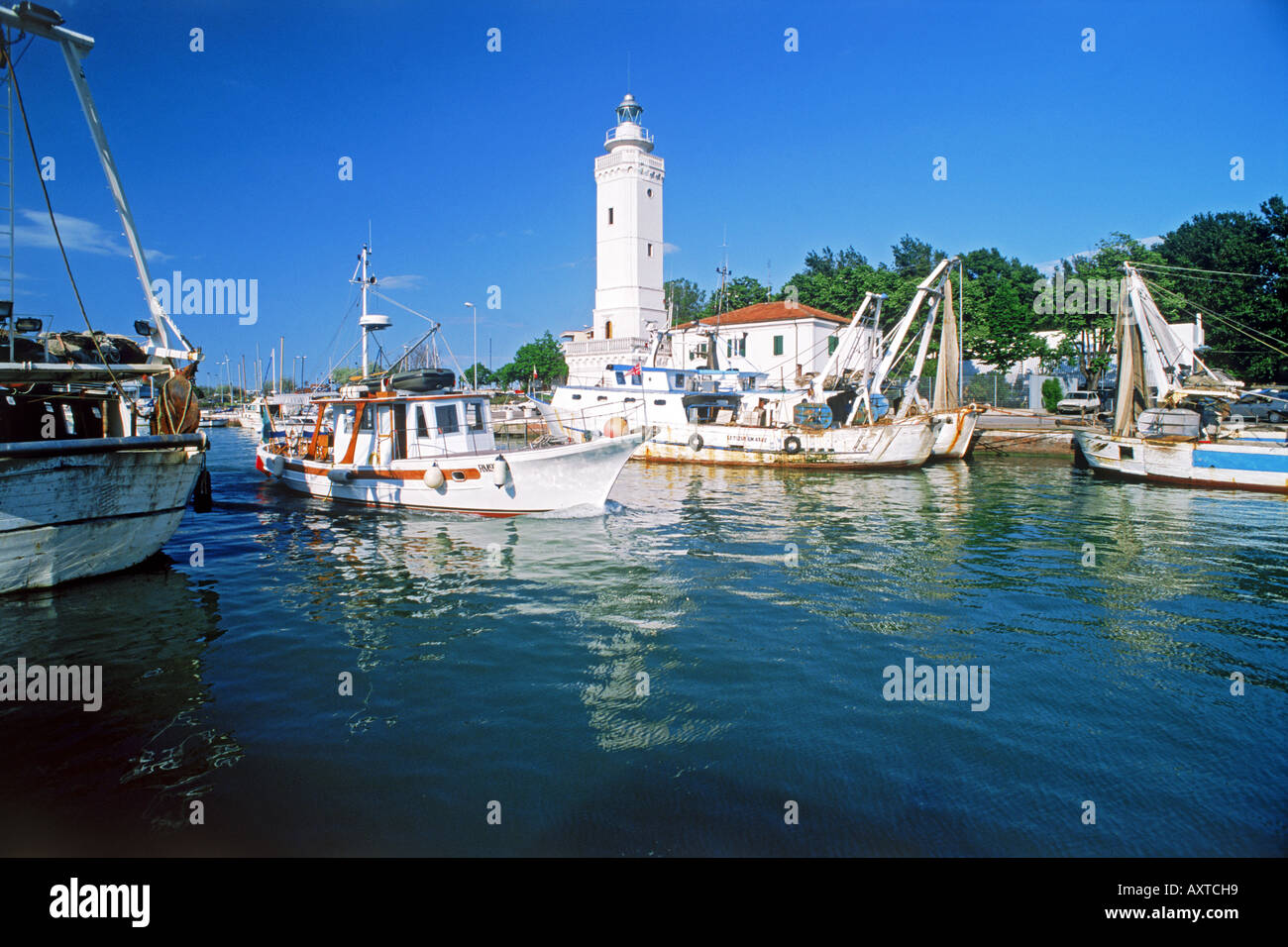 Boats and lighthouse at Rimini Harbour (Emilia Romagna) in Adriatic Sea ...