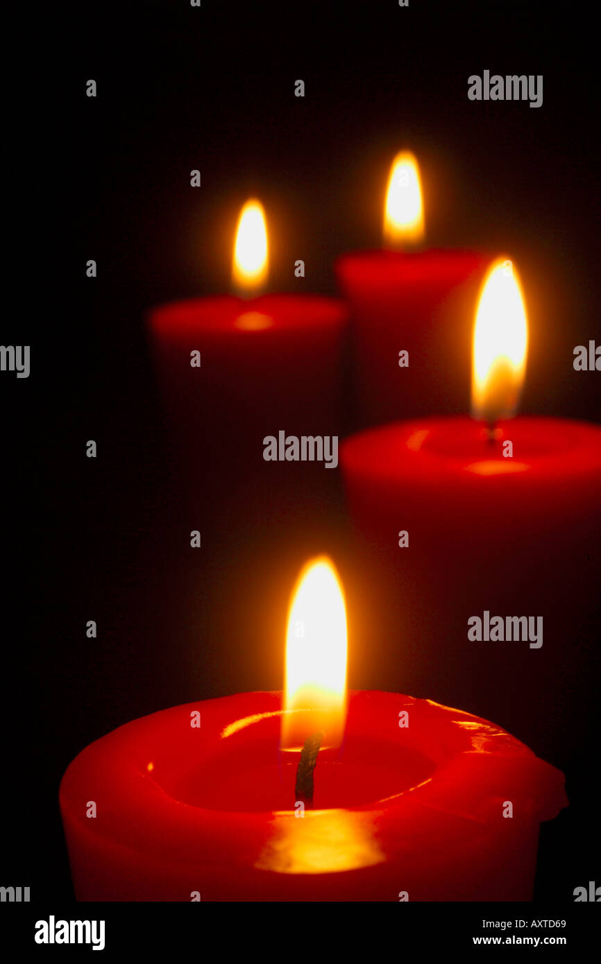 Four lighted candles hi-res stock photography and images - Alamy