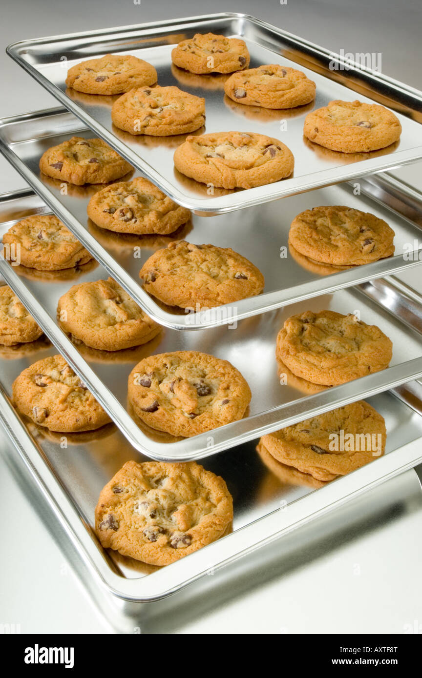 Chocolate chip cookies cooling on trays Stock Photo - Alamy