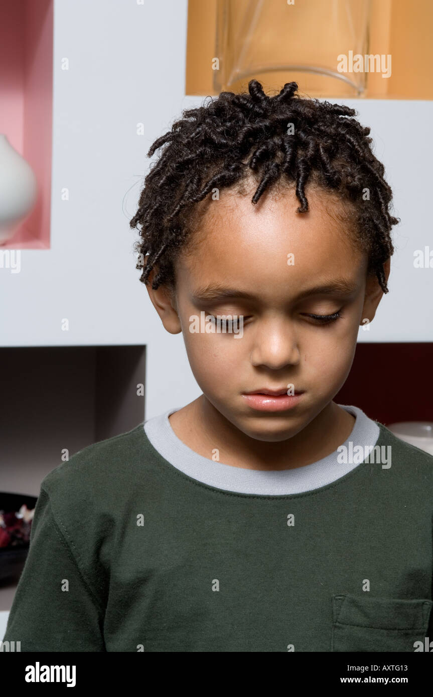 Portrait of a young boy who is sad Stock Photo - Alamy