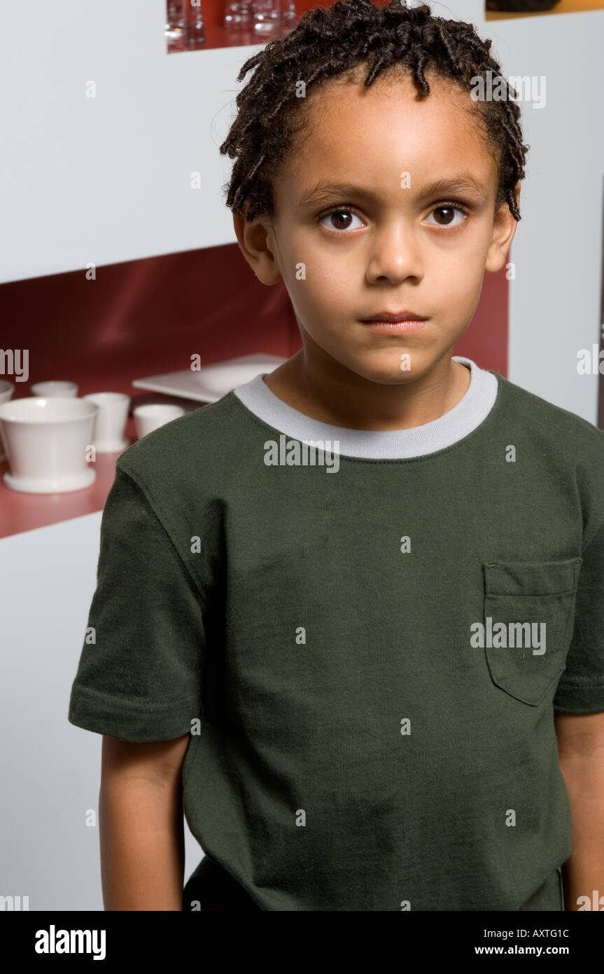Portrait of a young boy showing no emotion Stock Photo - Alamy