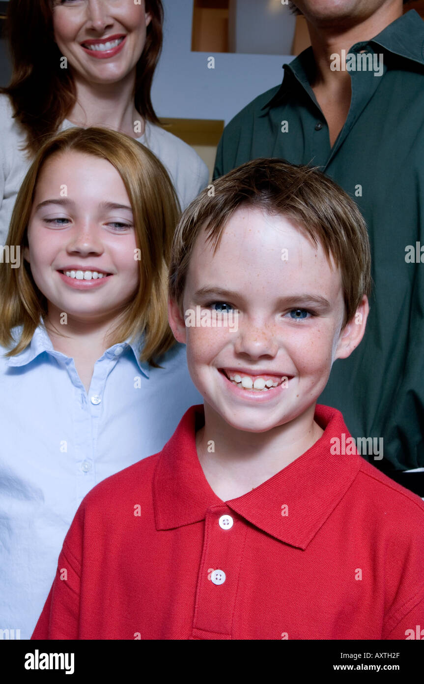 Portrait of two kids infront of their parents Stock Photo - Alamy