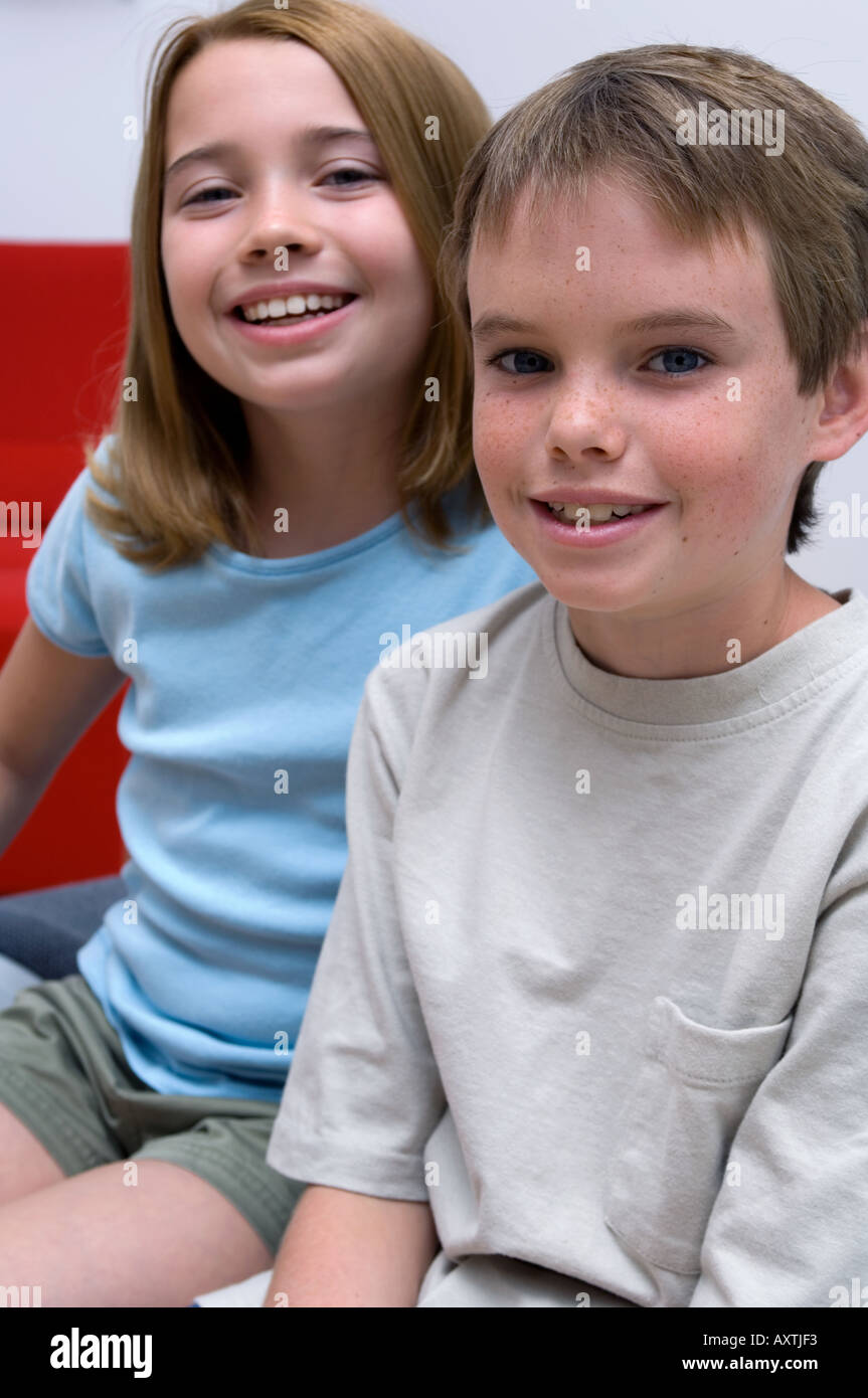 Two young kids talking and laughing with each other Stock Photo - Alamy