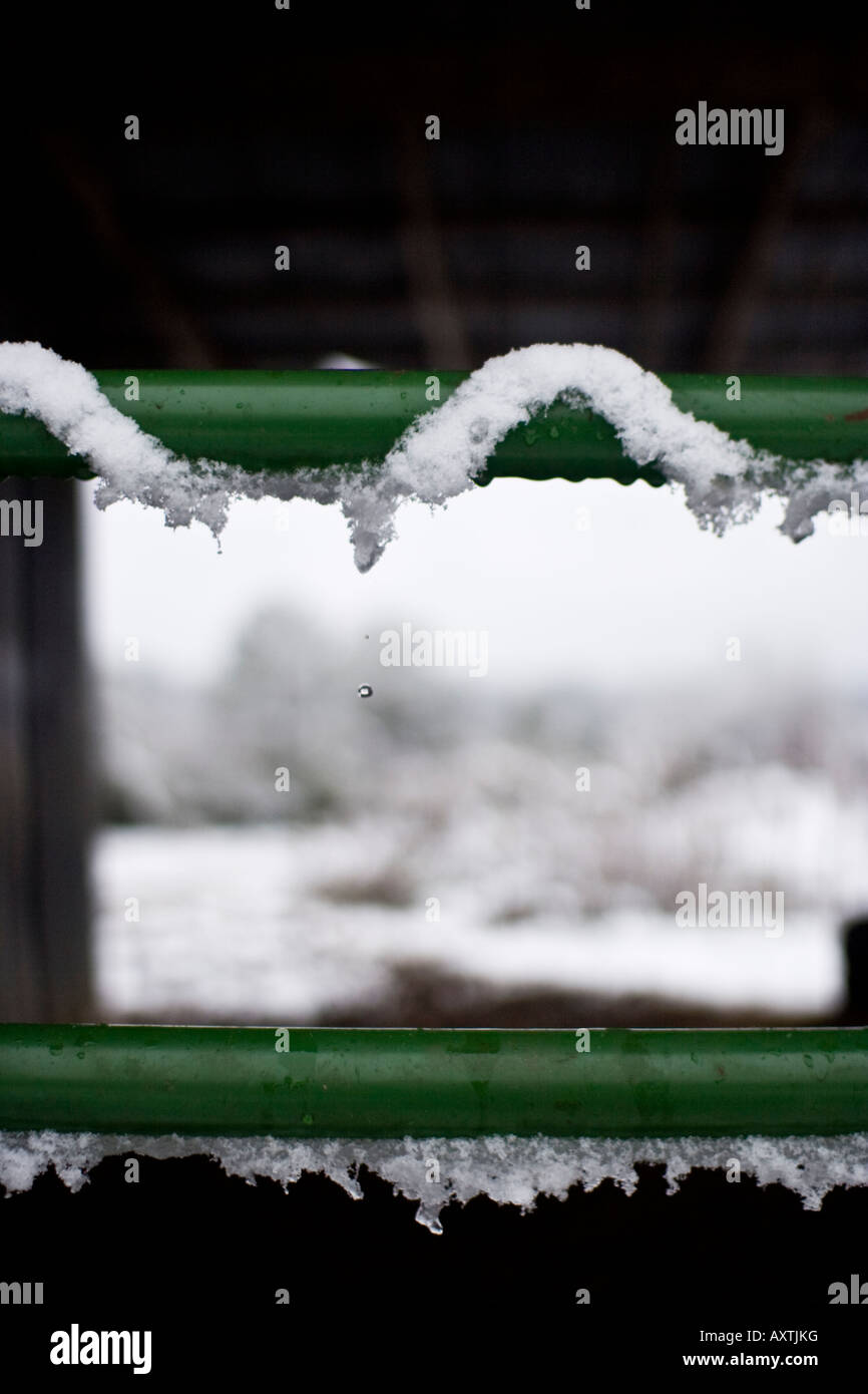 Snow melting on gate Stock Photo - Alamy