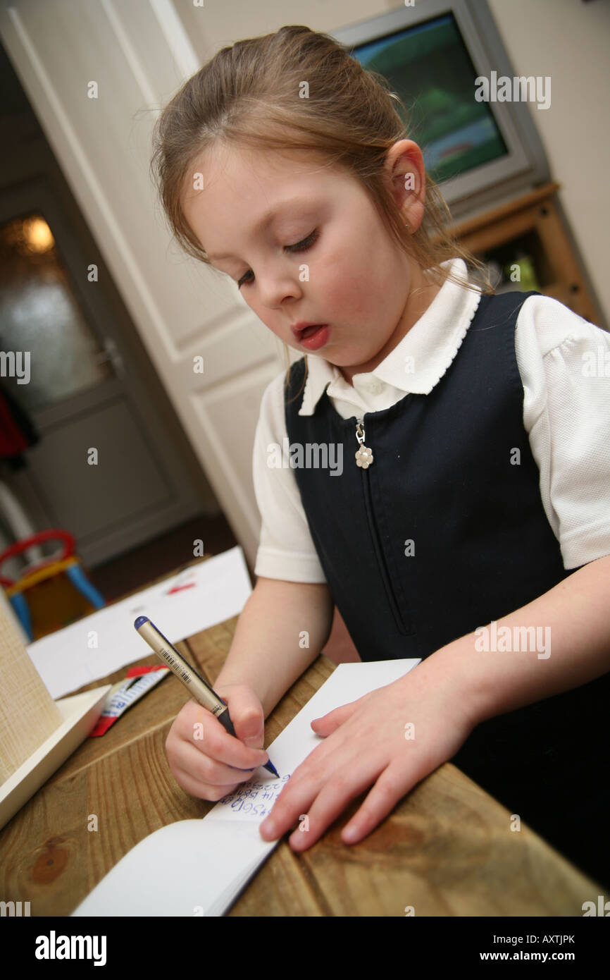 Little girl writing Stock Photo - Alamy