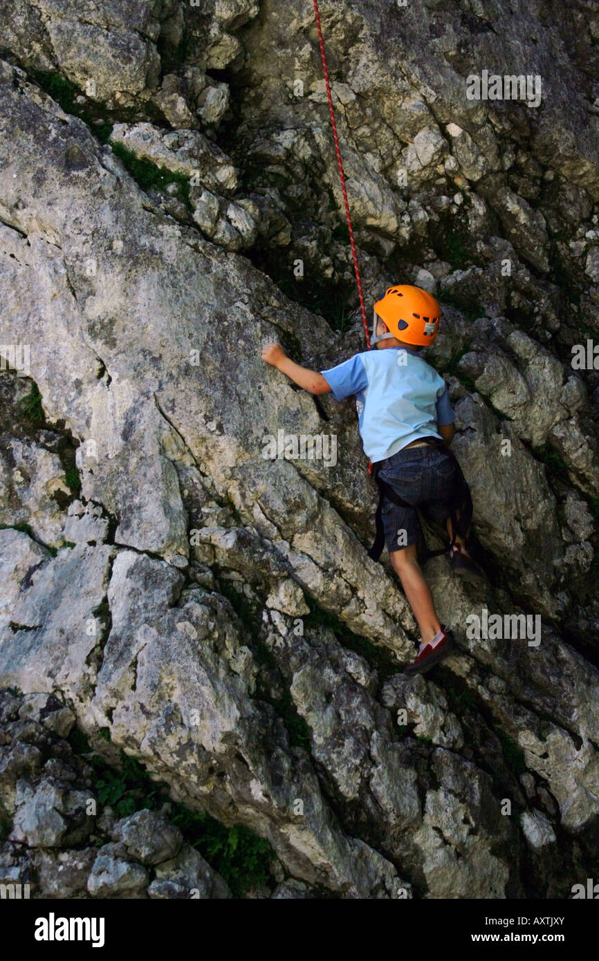 Starting up young. Kid climbing the mountain Stock Photo - Alamy