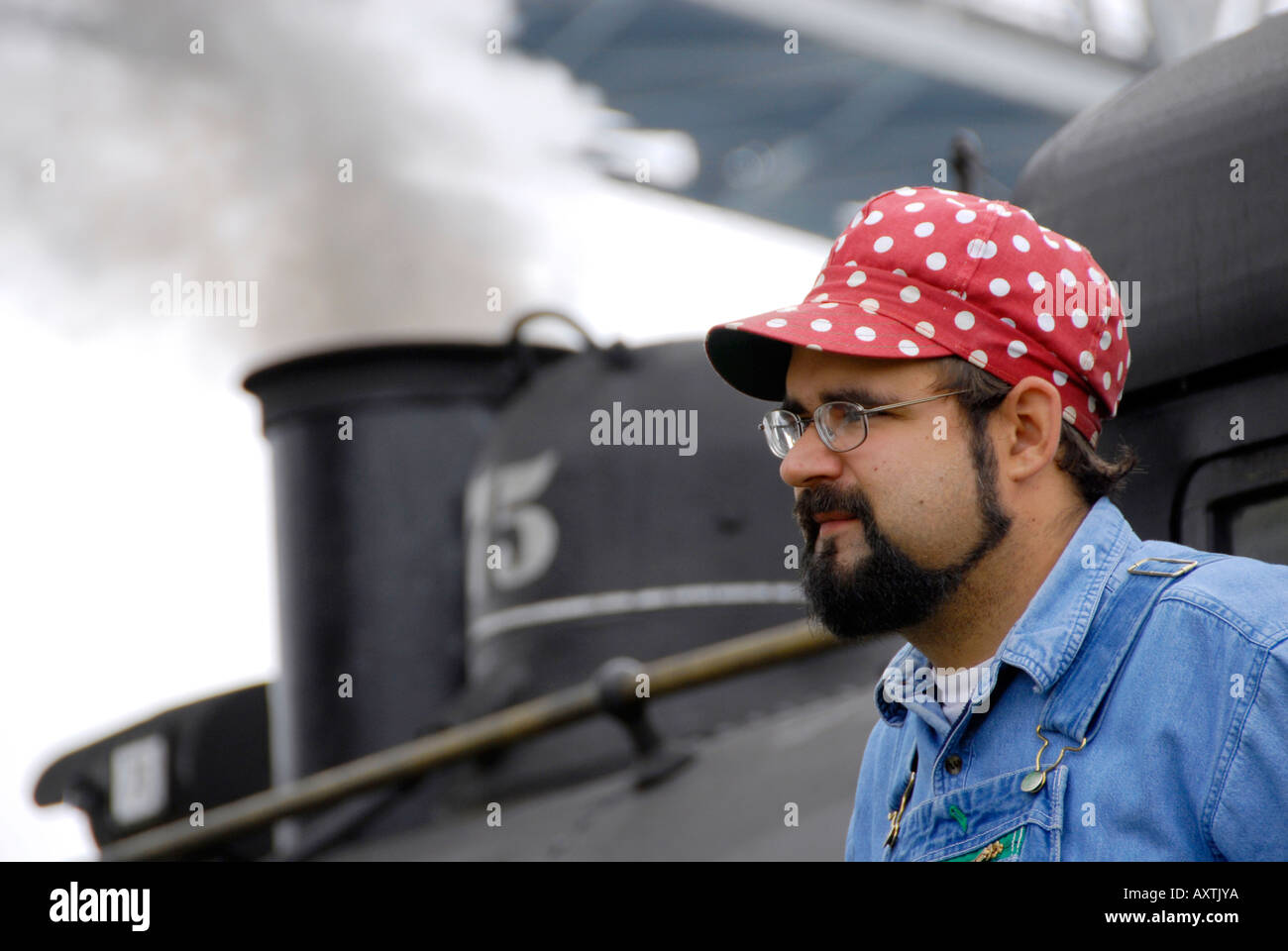 Historic steam Train locomotive engineer portrait with red and white ...