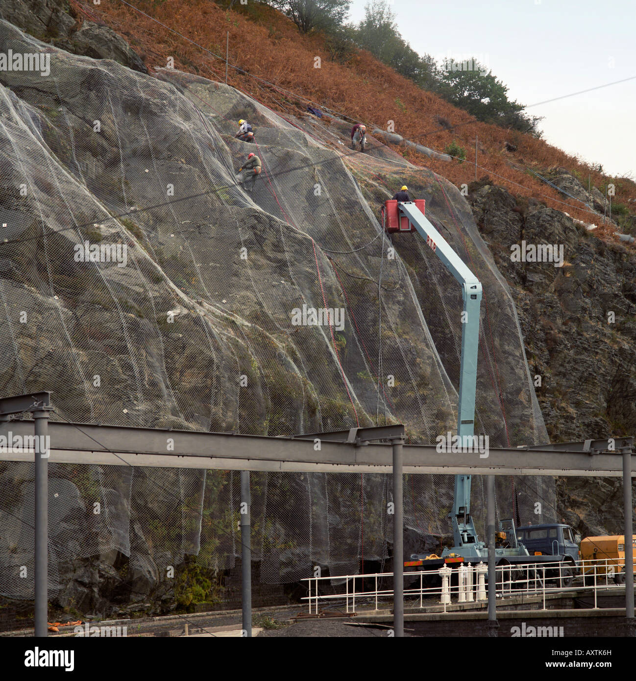 Rock bolting of cliff face to protect water treatment plant below from ...